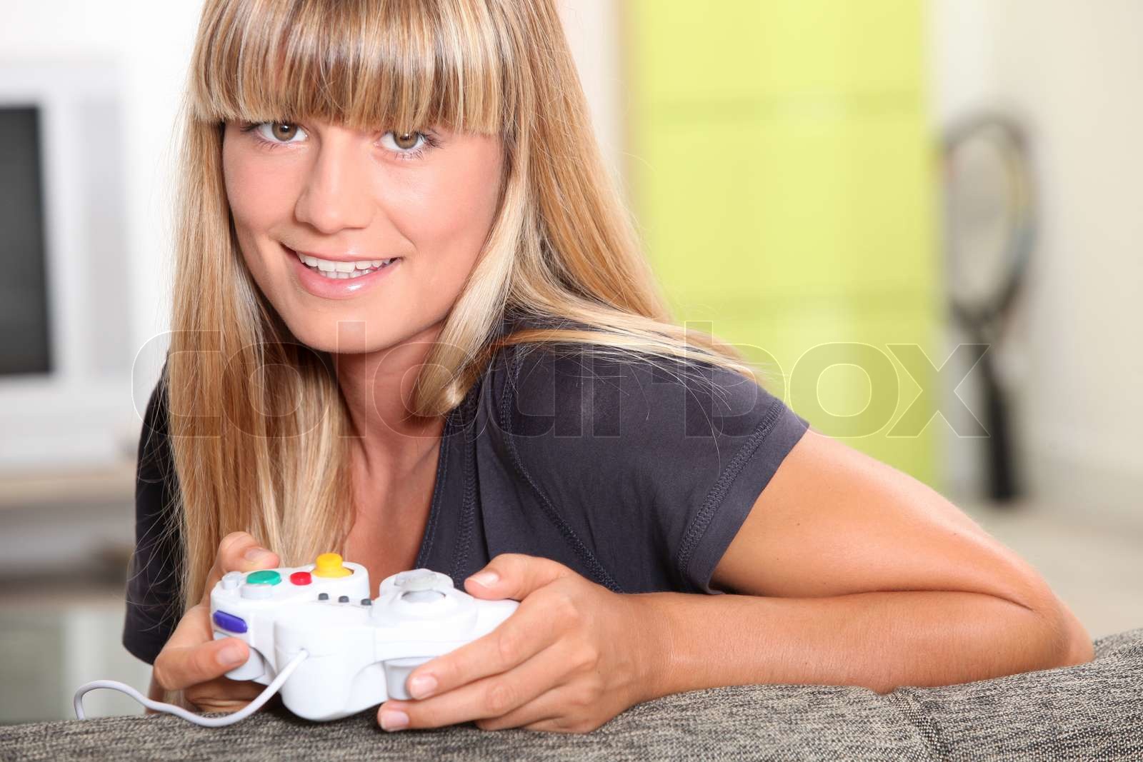 Girl playing computer games | Stock image | Colourbox