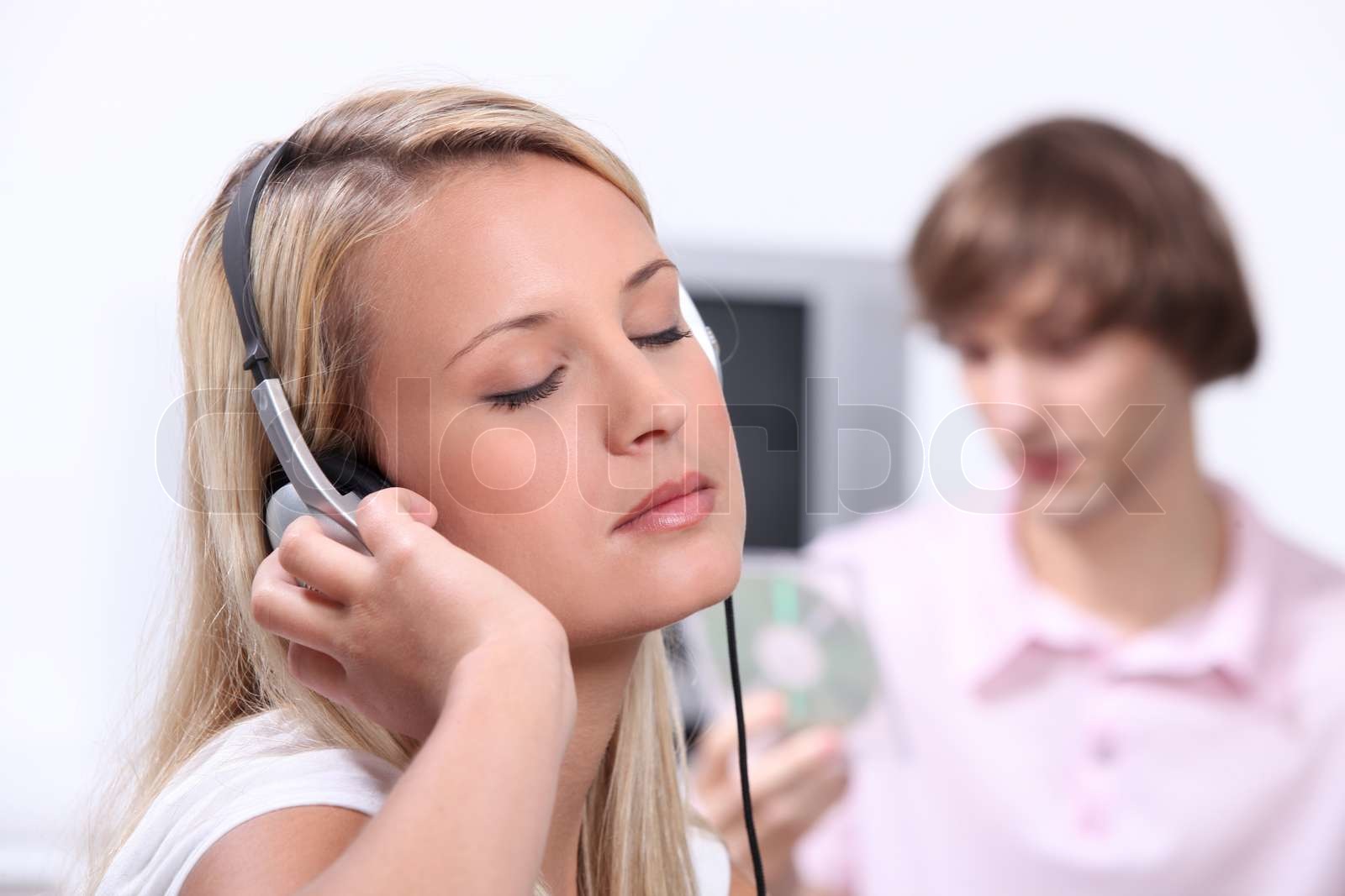 Young woman completely enthralled by a song | Stock image | Colourbox