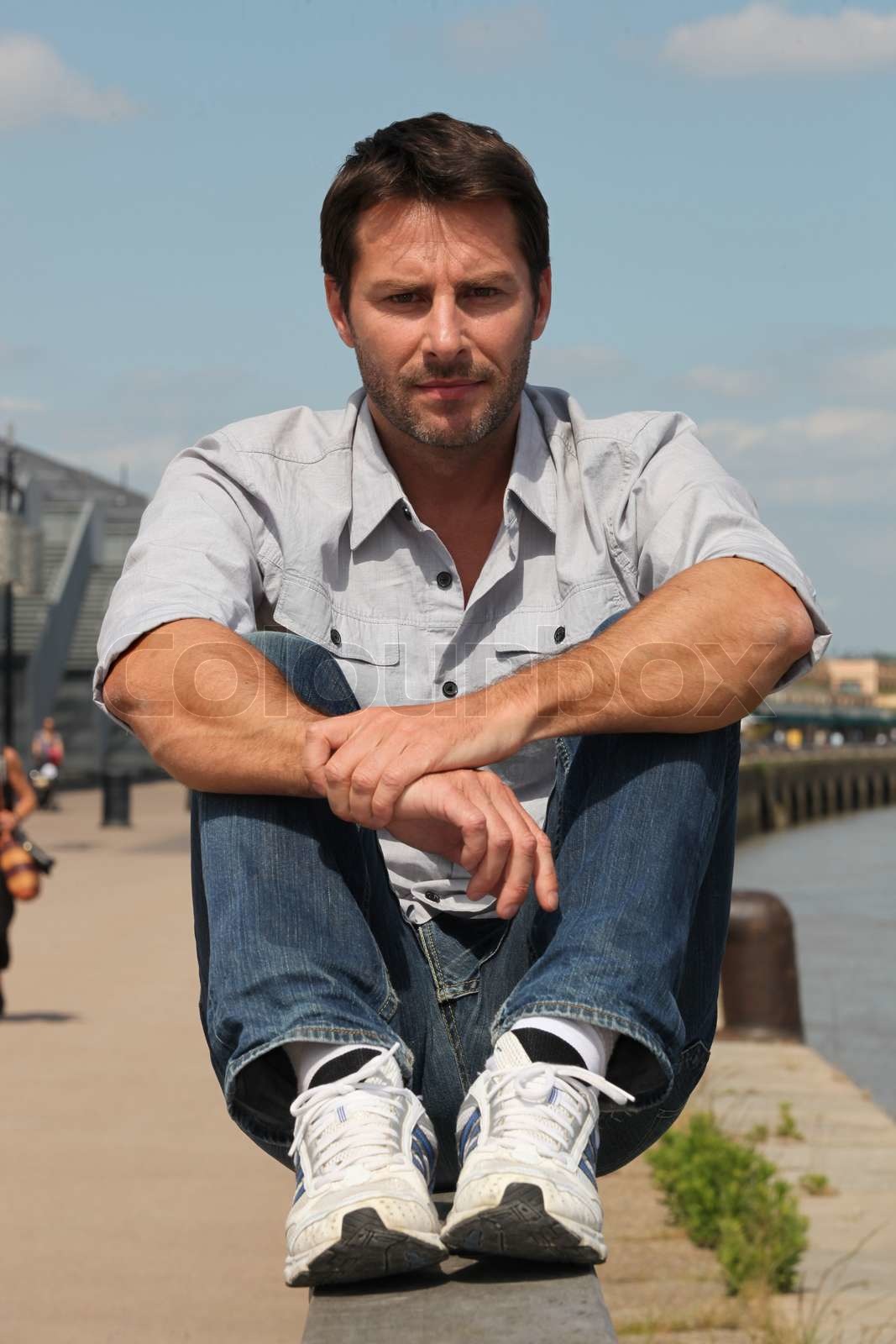 Man sitting outside. | Stock image | Colourbox