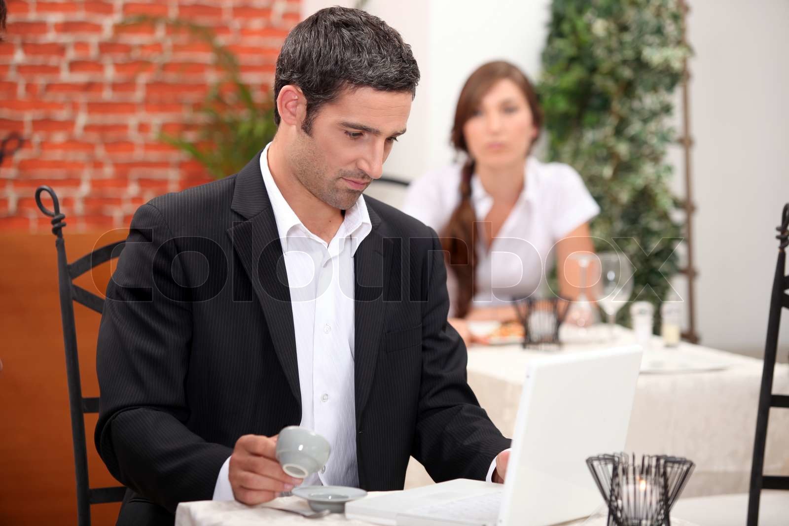 Man having a coffee in a restaurant | Stock image | Colourbox