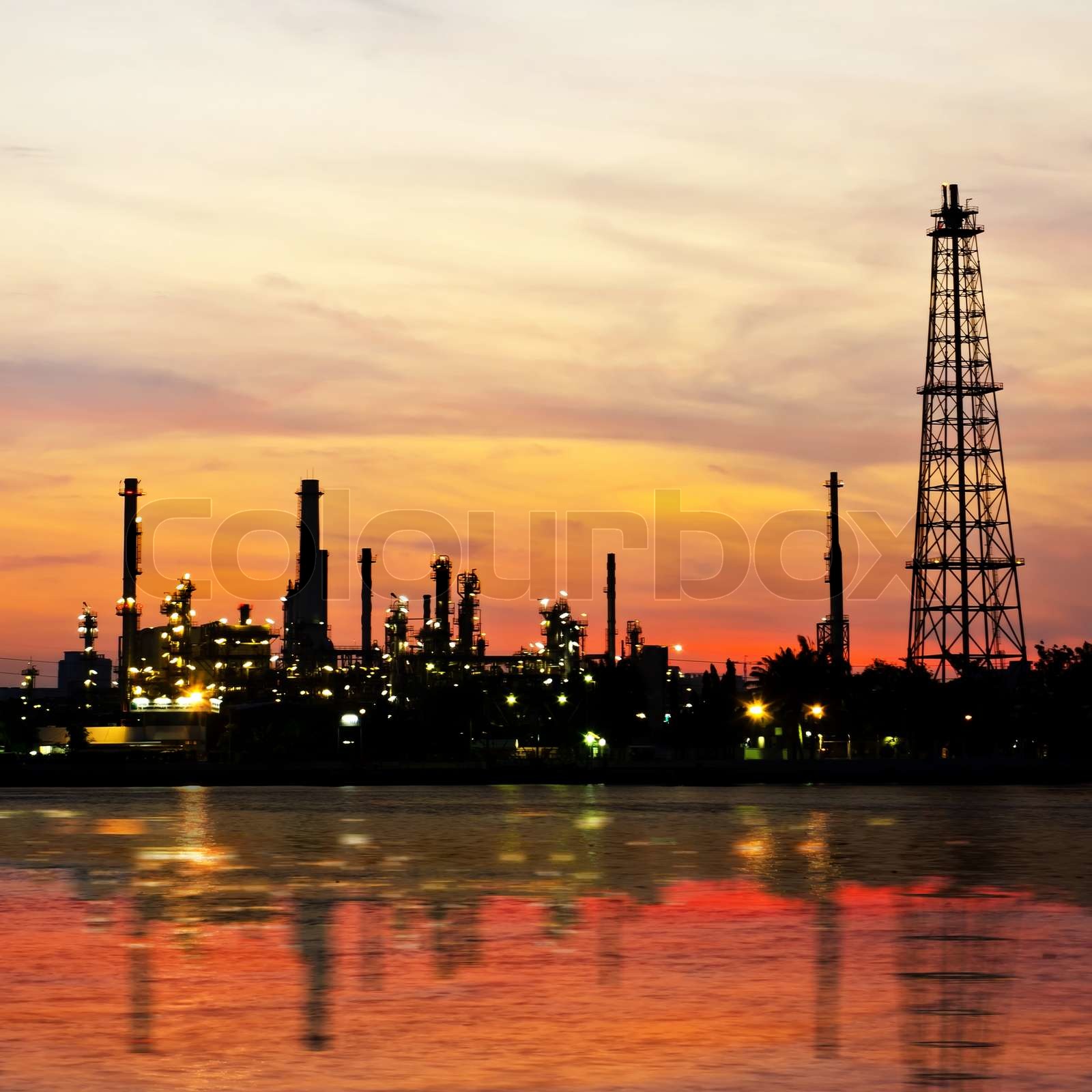 Petroleum oil refinery factory over sunrise | Stock image | Colourbox