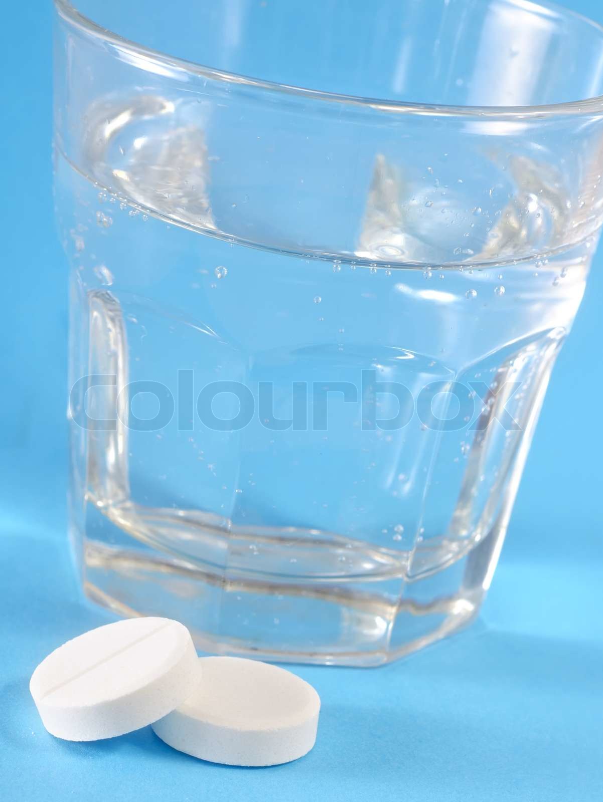 white pills and water | Stock image | Colourbox