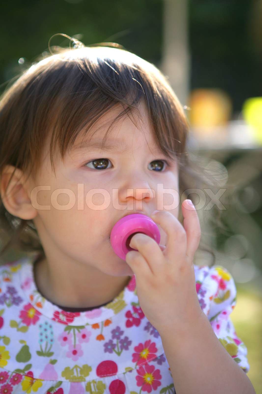 Child with a pacifier | Stock image | Colourbox