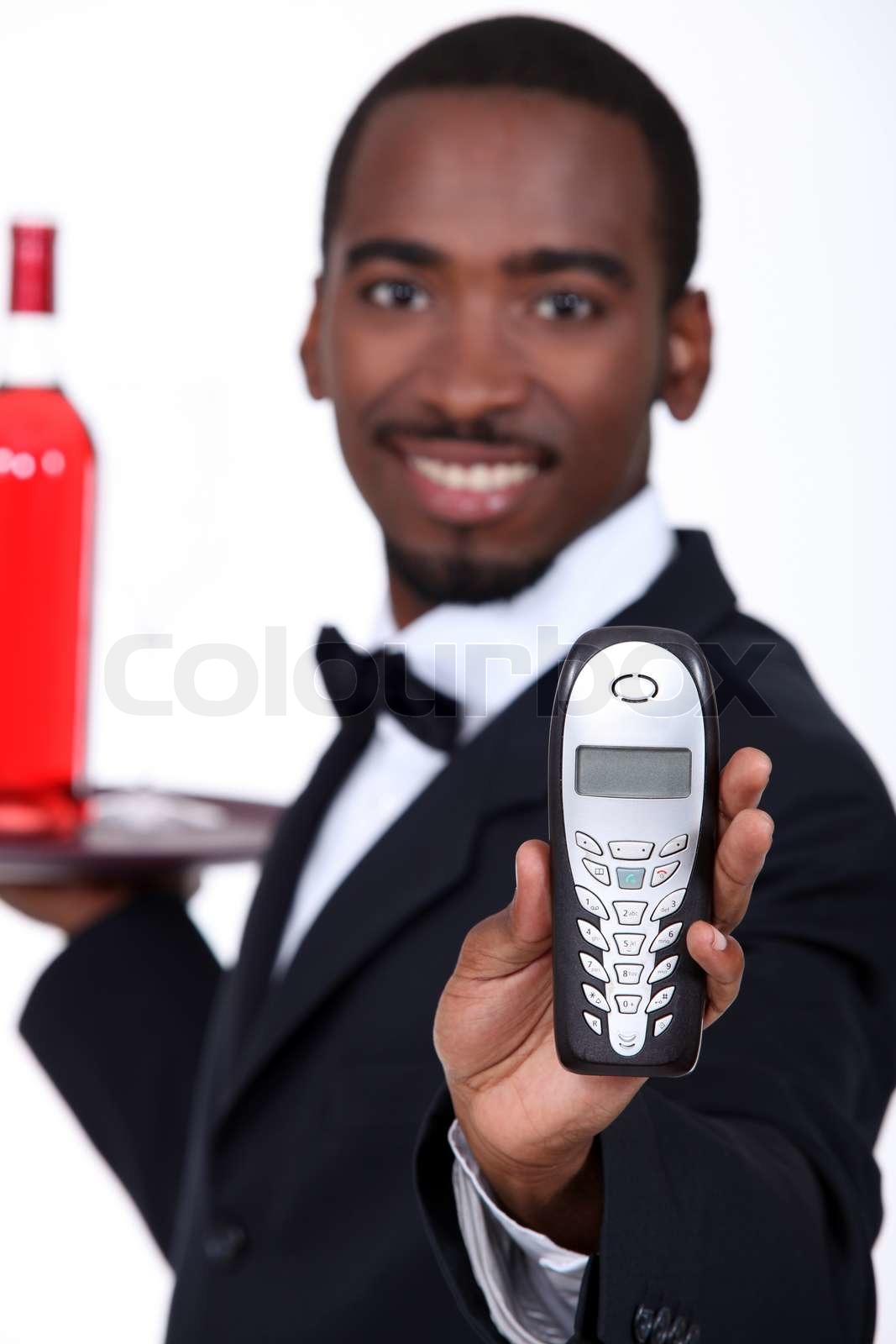 Male server holding mobile | Stock image | Colourbox