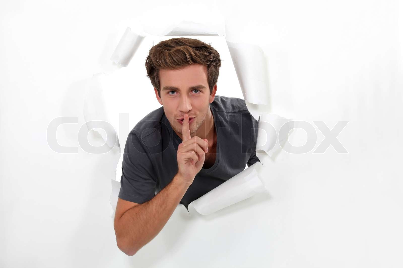 Man making shush gesture | Stock image | Colourbox