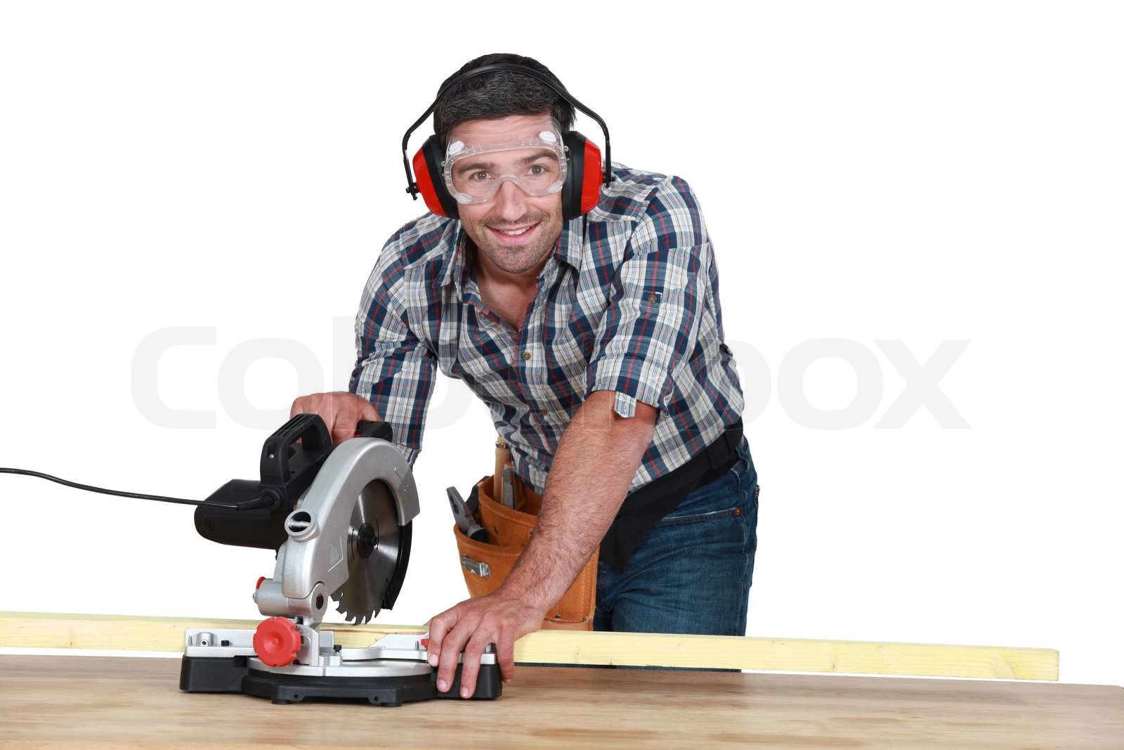 Man using circular saw | Stock image | Colourbox