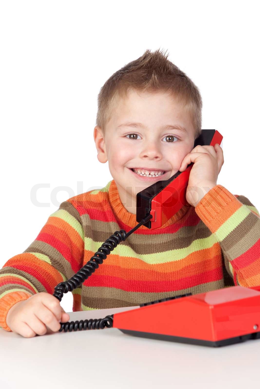 Adorable child with a tradicional telephone | Stock image | Colourbox