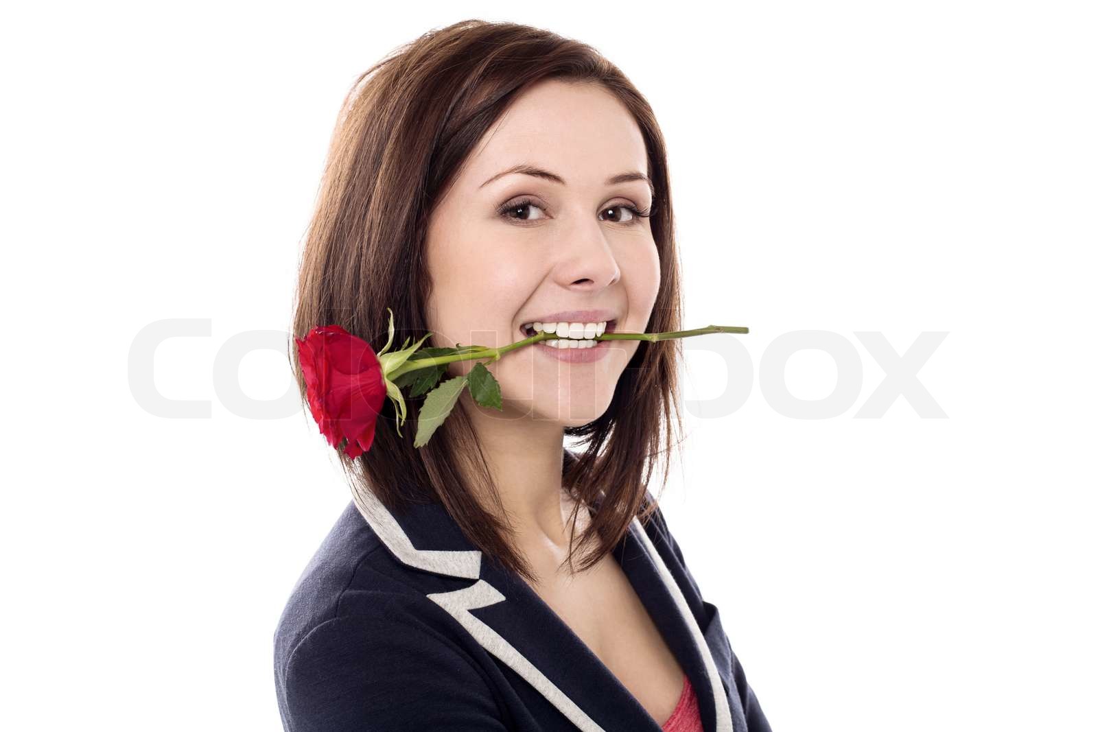 Girl holding rose between her teeth | Stock image | Colourbox