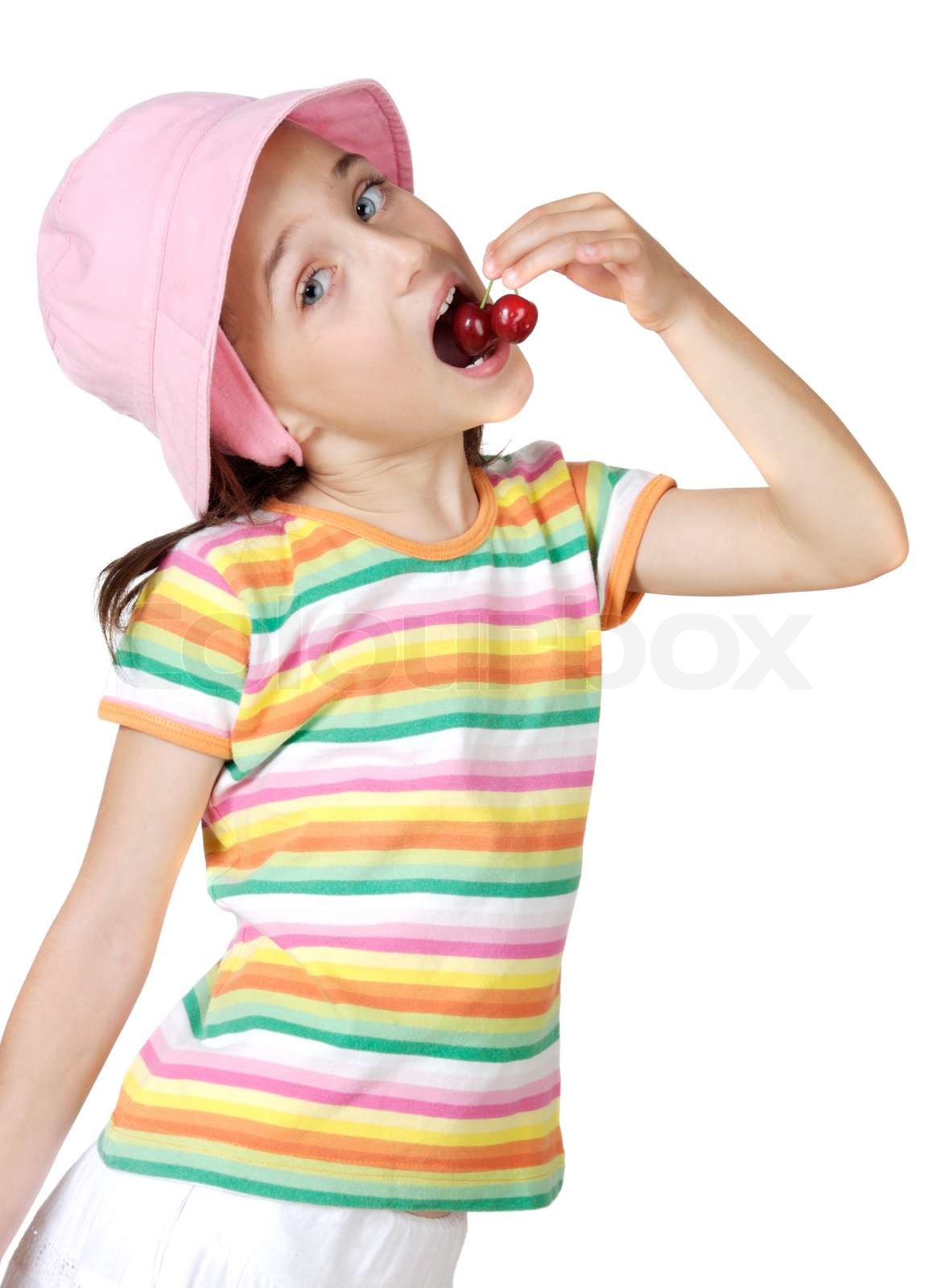 Girl eating cherries | Stock image | Colourbox