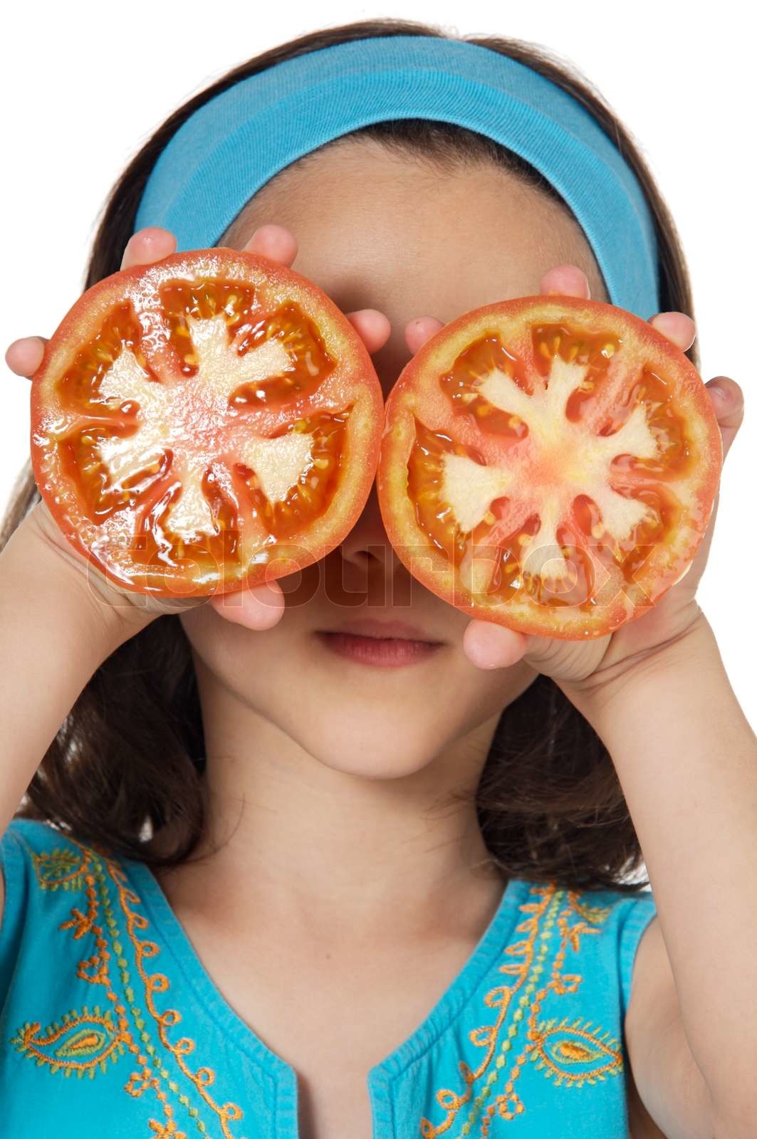 Girl with tomatoes in her eyes | Stock image | Colourbox