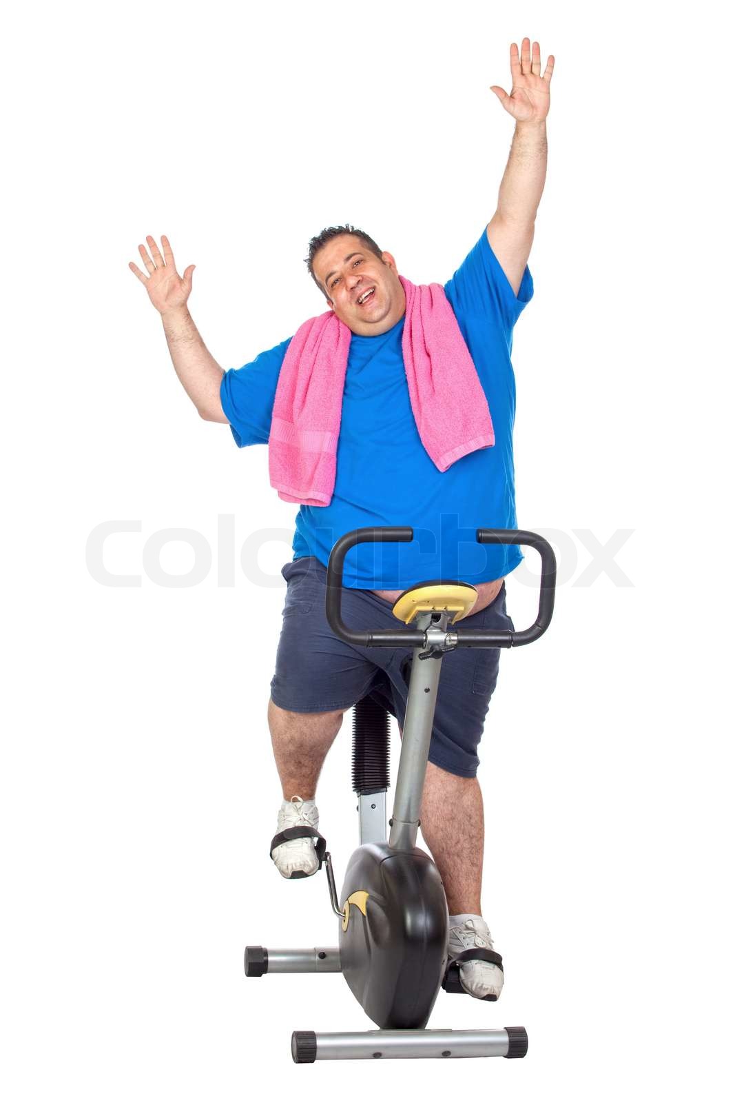 Fat Man in a Static Bicycle | Stock image | Colourbox