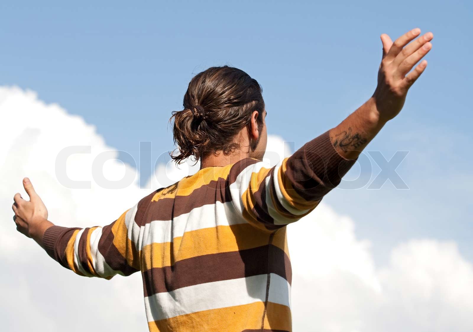 Young man with open arms | Stock image | Colourbox
