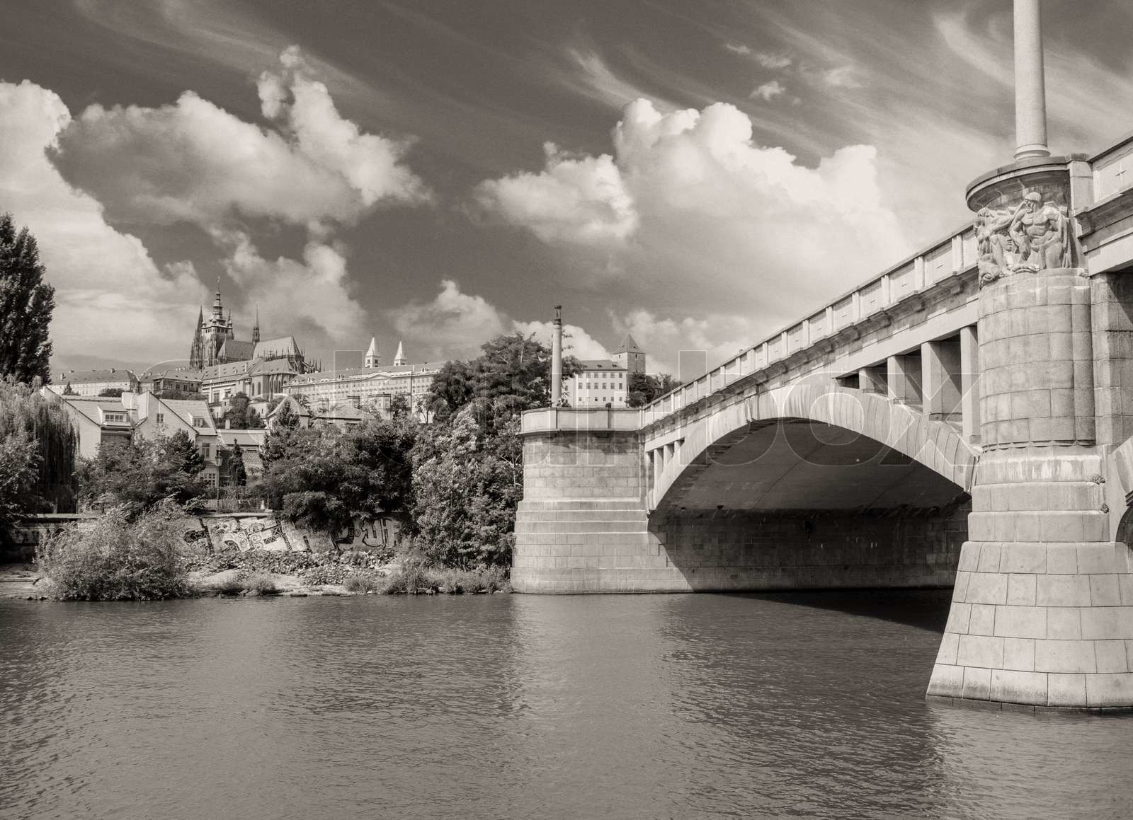 Ancient Medieval Bridge with River and Vegetation | Stock image | Colourbox
