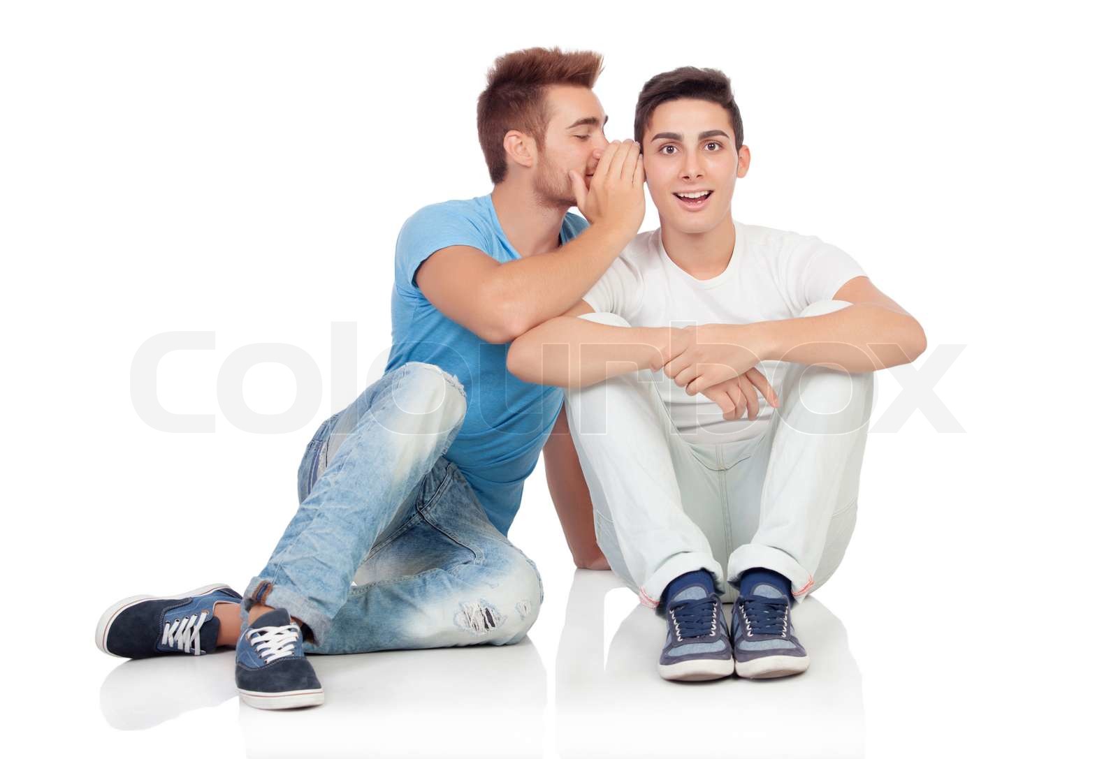 Two brothers whispering | Stock image | Colourbox