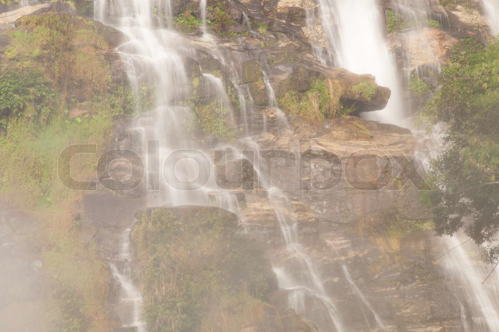 Waterfall flowing over a cliff | Stock image | Colourbox