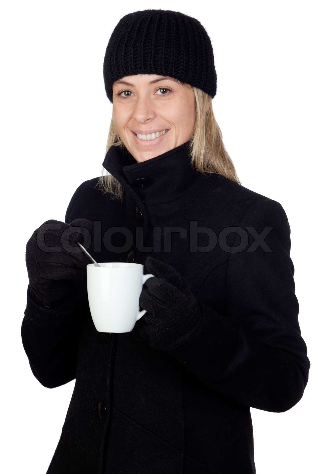 Blonde woman drinking something hot | Stock image | Colourbox