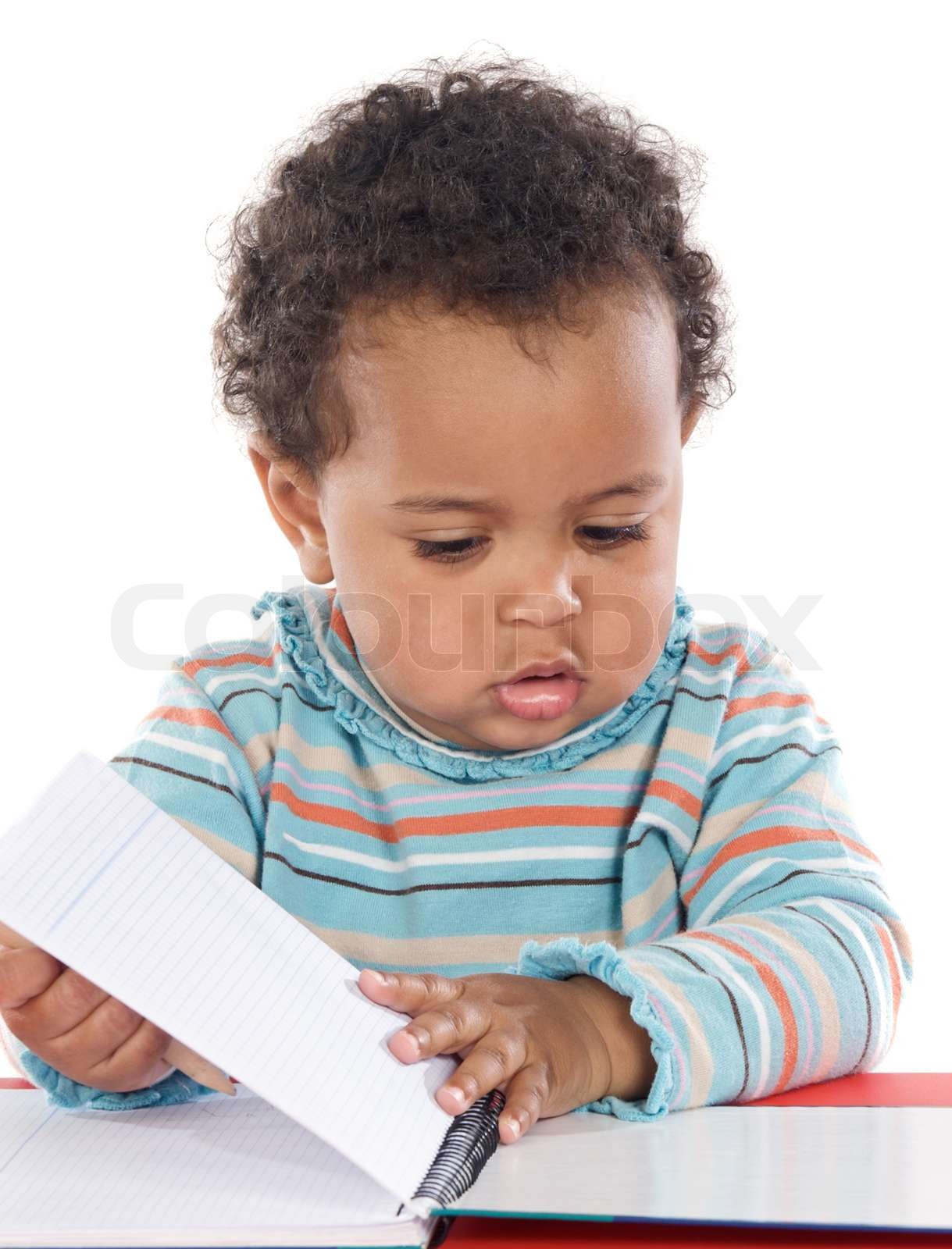 Adorable baby studying | Stock image | Colourbox
