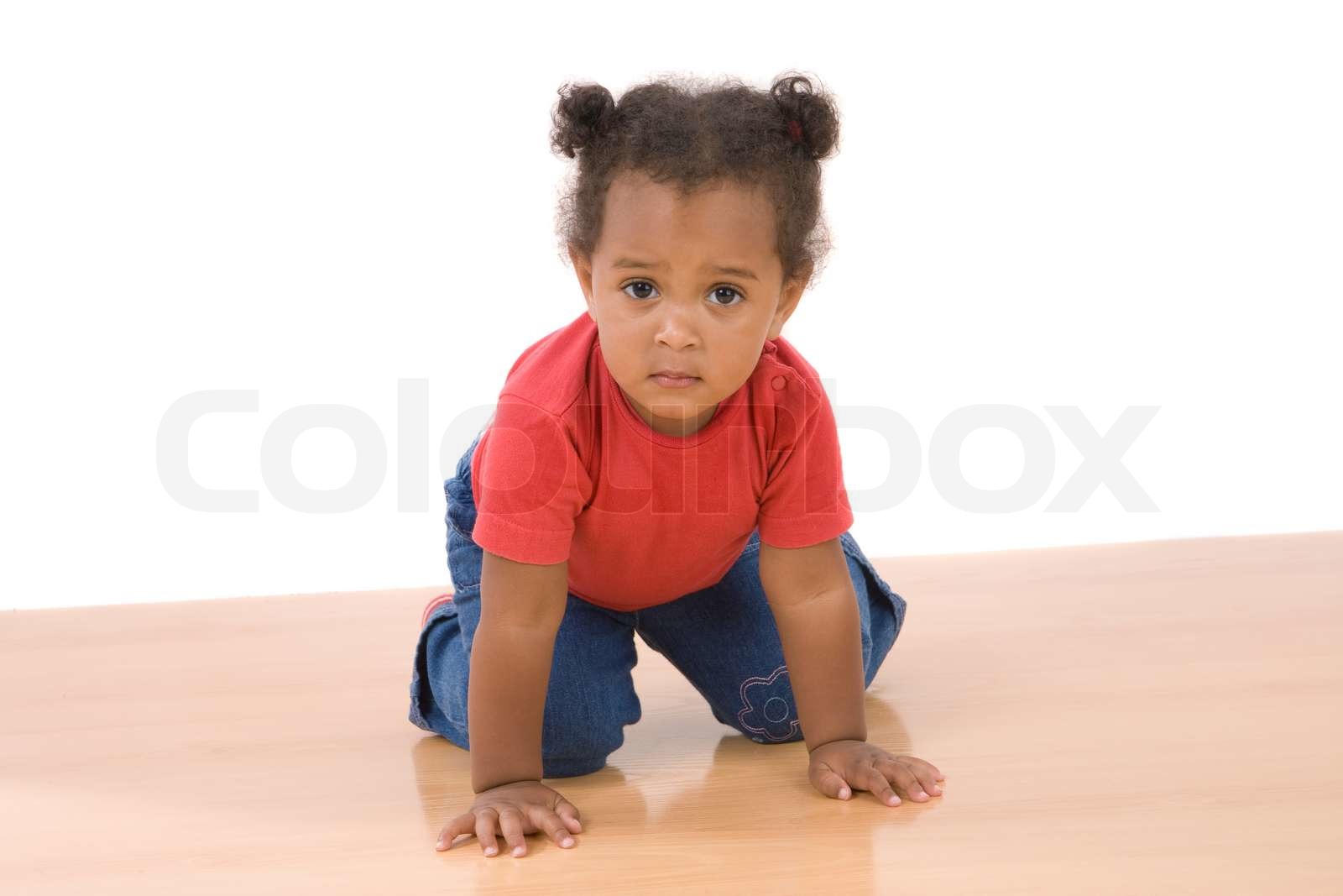 Adorable african baby crawl | Stock image | Colourbox