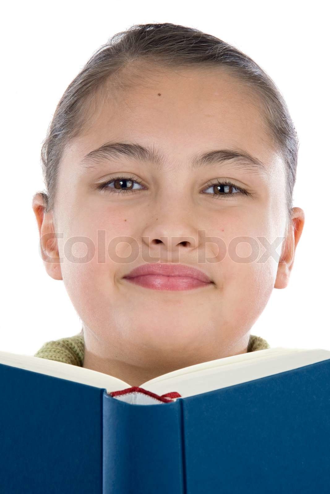 Adorable girl with a book | Stock image | Colourbox