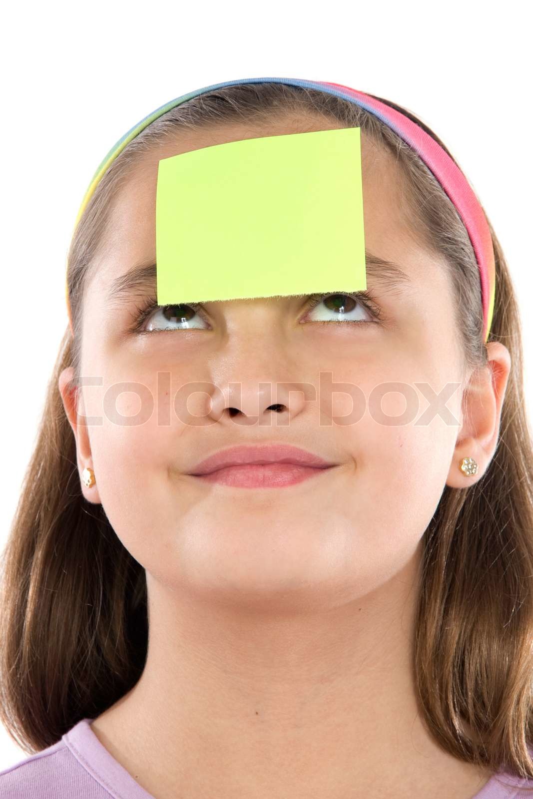 Adorable girl with post-it in her front | Stock image | Colourbox