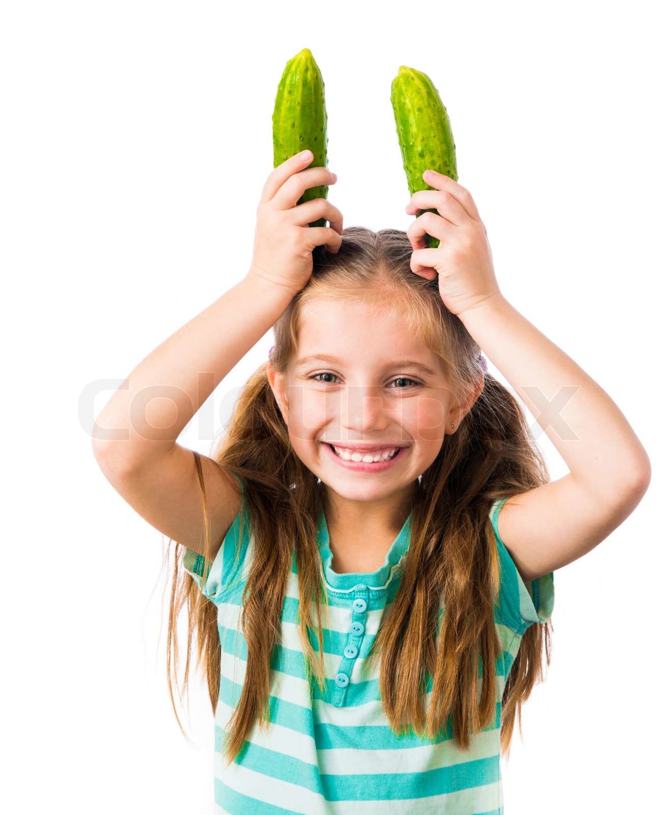 little girl with cucumbers | Stock image | Colourbox