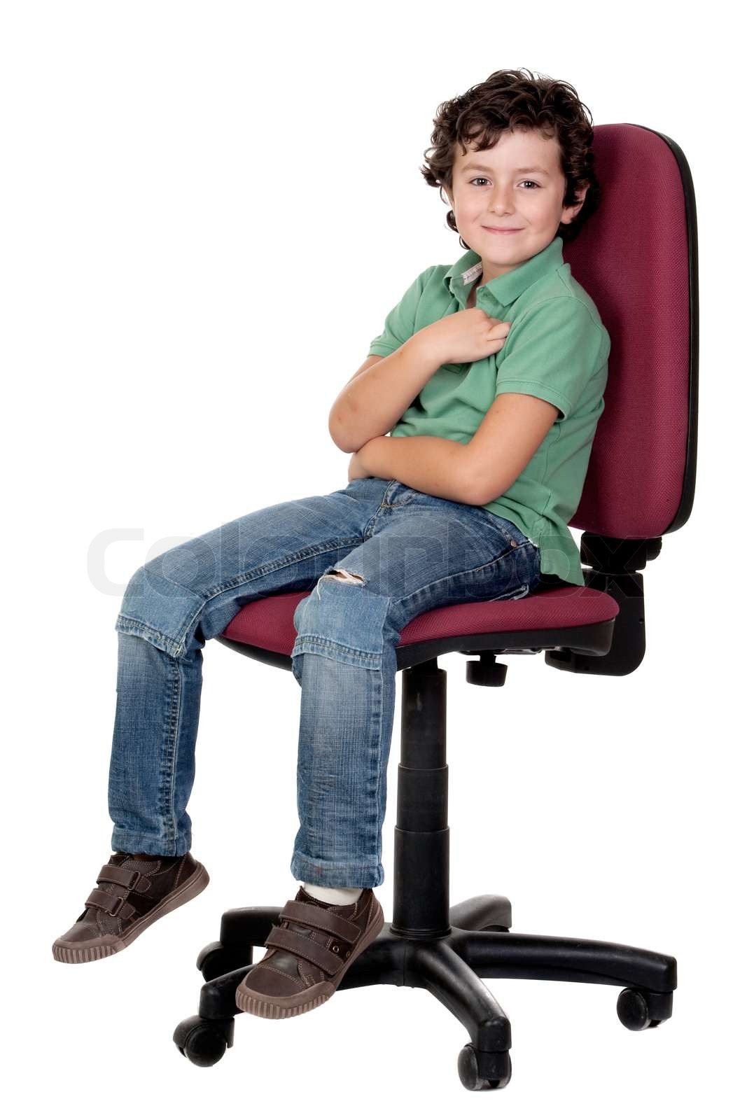 Adorable little boy sitting on big chair | Stock image | Colourbox