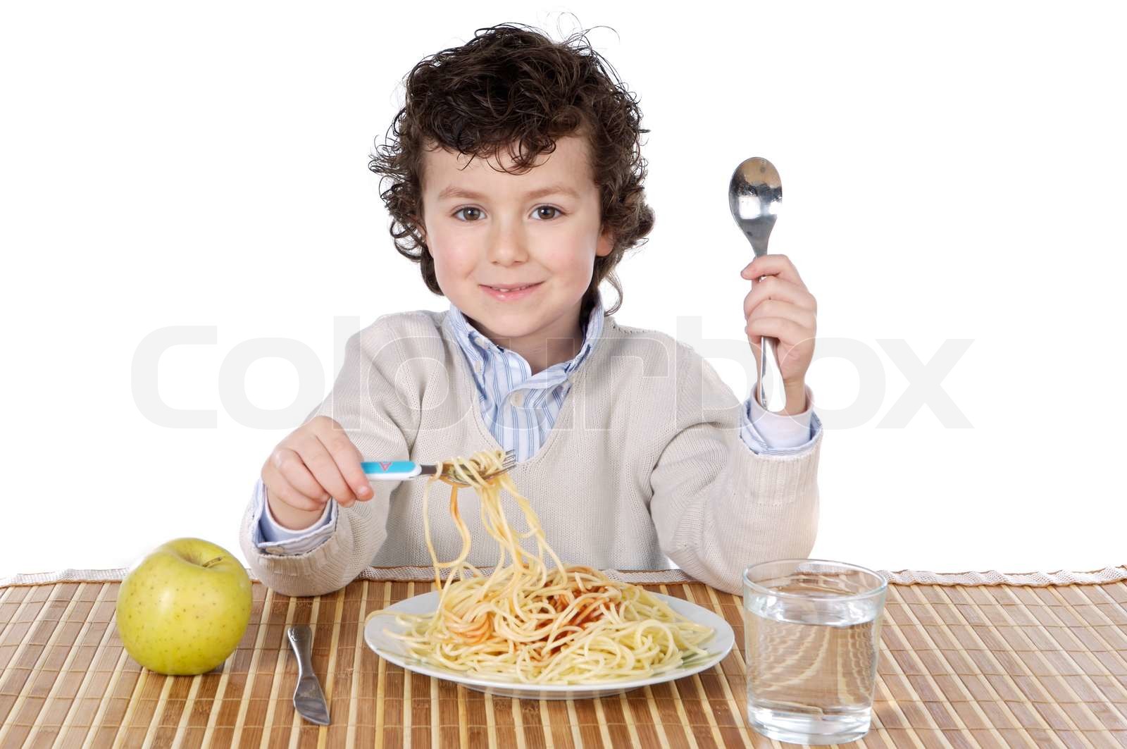 Adorable child hungry at the time of eating | Stock image | Colourbox