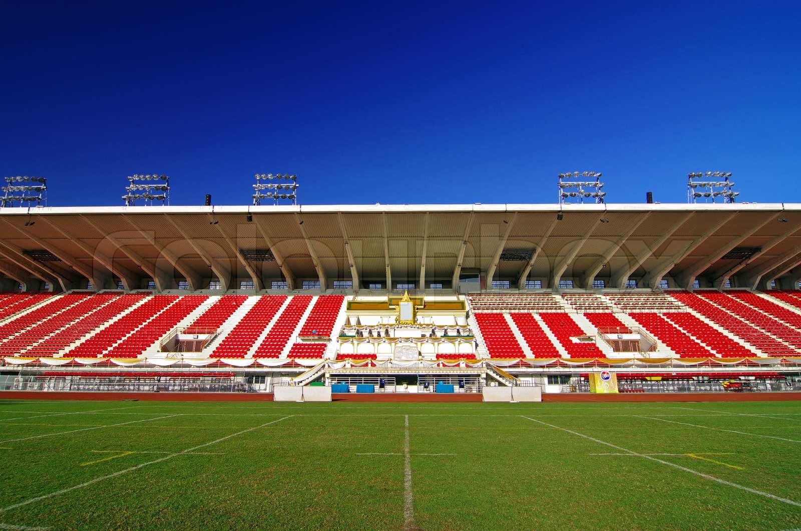 amphitheater stadium with red seats under blue sky | Stock image ...