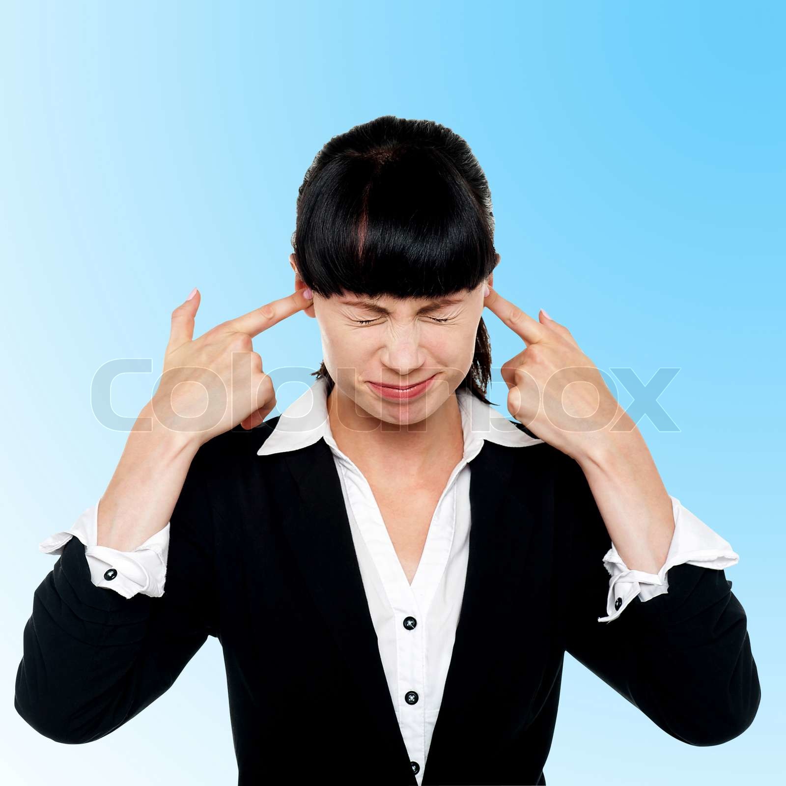 Female employee covering her ears | Stock image | Colourbox