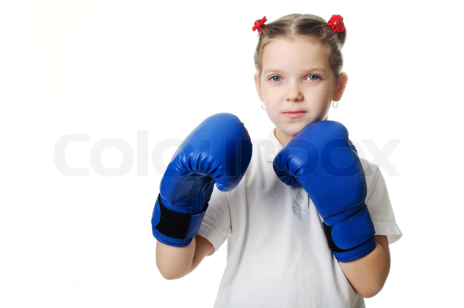 Beautiful young little girl wearing a pair of boxing gloves | Stock ...