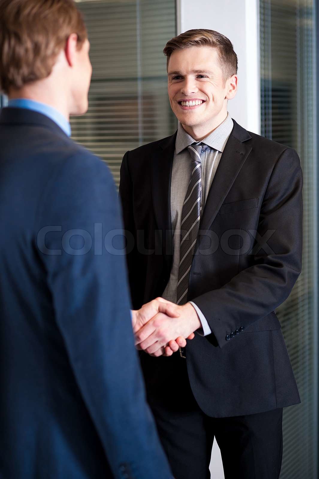 Corporate guys shaking hands | Stock image | Colourbox