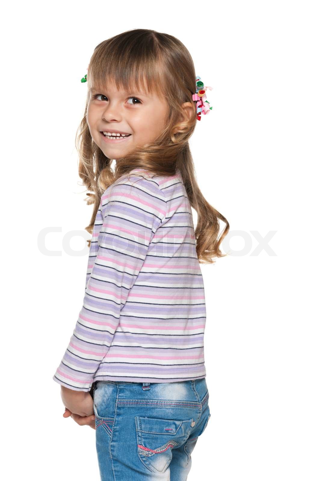 Joyful little girl looks back | Stock image | Colourbox