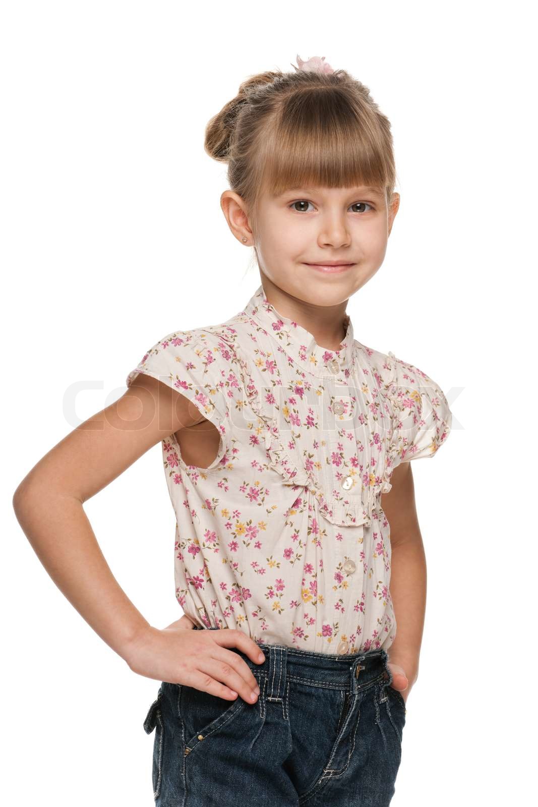 Smiling little girl looks forward | Stock image | Colourbox