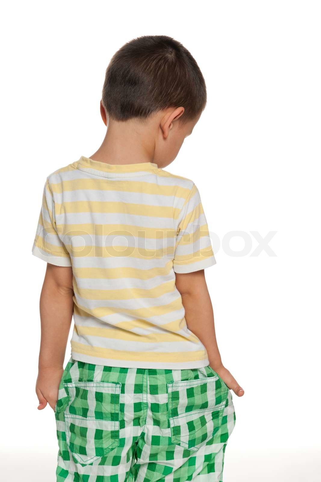 Little boy stands back | Stock image | Colourbox