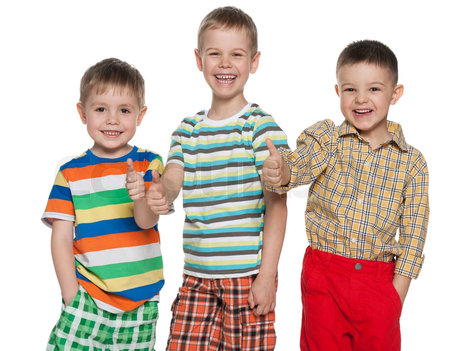Three happy cute boys holding thumbs up | Stock image | Colourbox