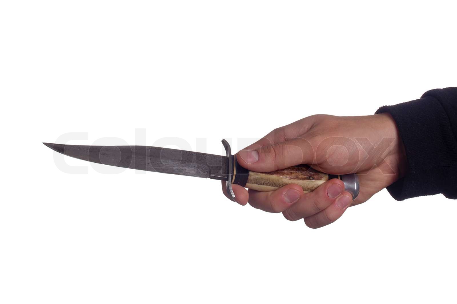 Hand with knife | Stock image | Colourbox