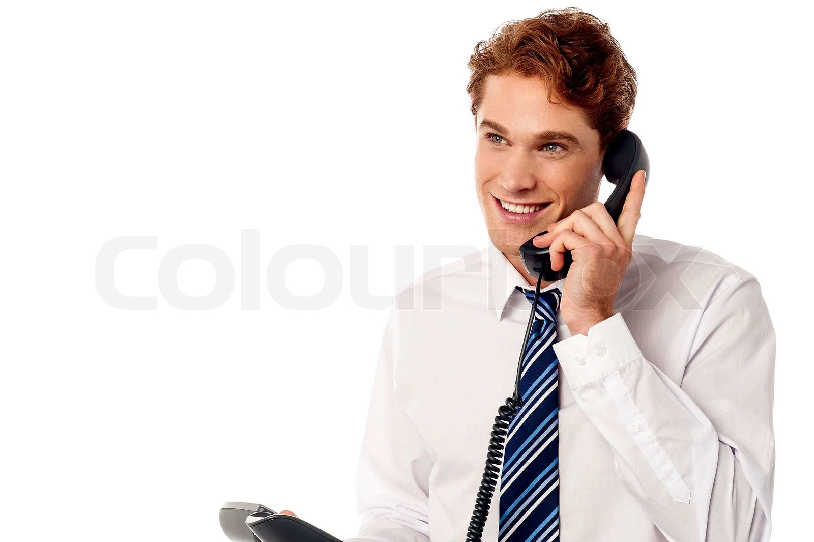 Young professional answering phone call | Stock image | Colourbox