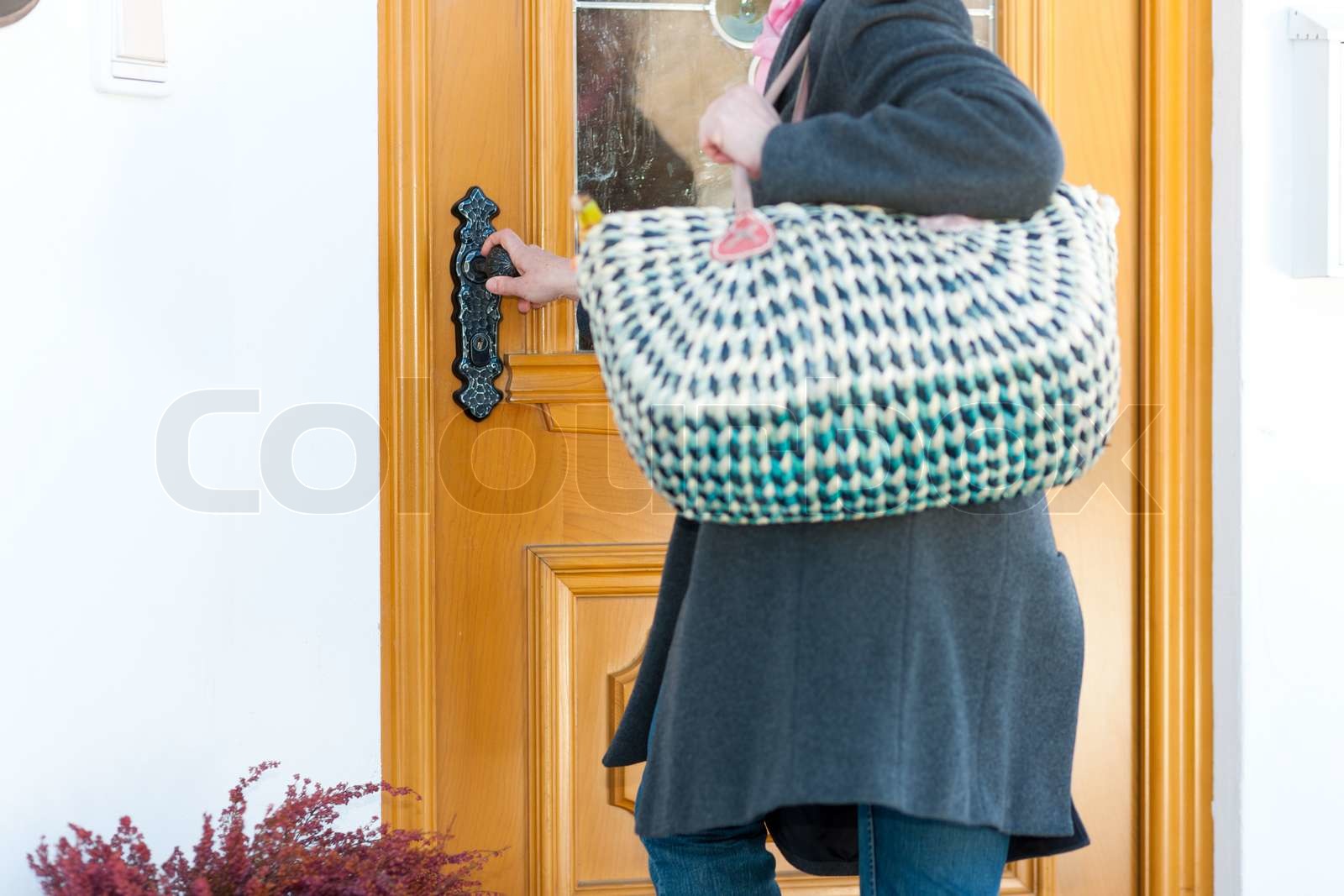 Woman coming home | Stock image | Colourbox