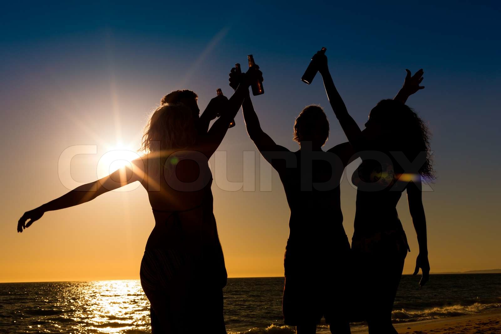 People having party at beach with drinks | Stock image | Colourbox