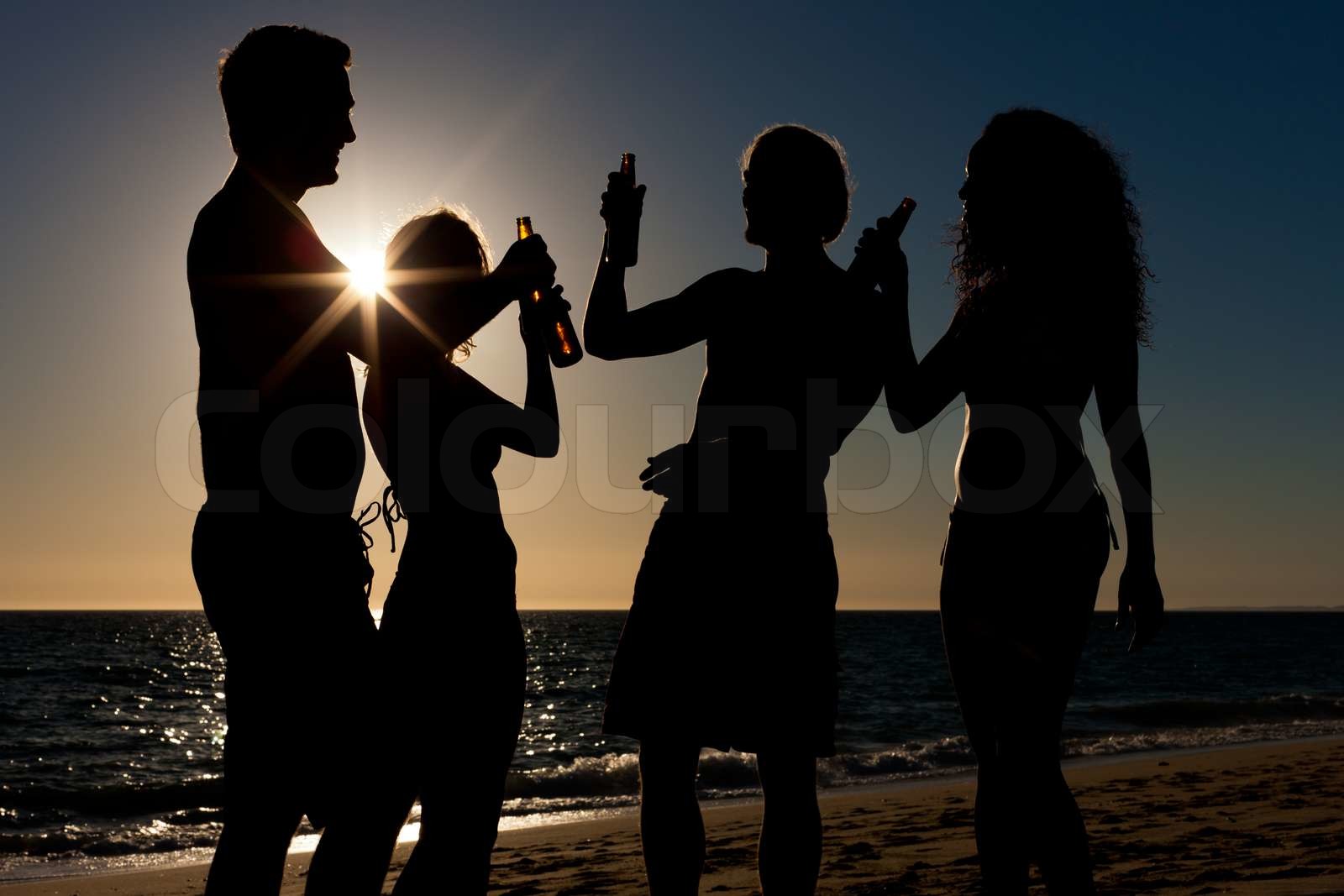 People having party at beach with drinks | Stock image | Colourbox