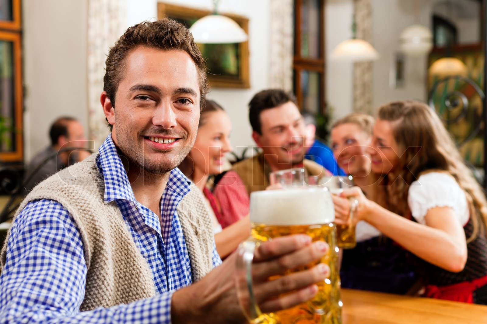 Man drinking beer in Bavarian pub | Stock image | Colourbox