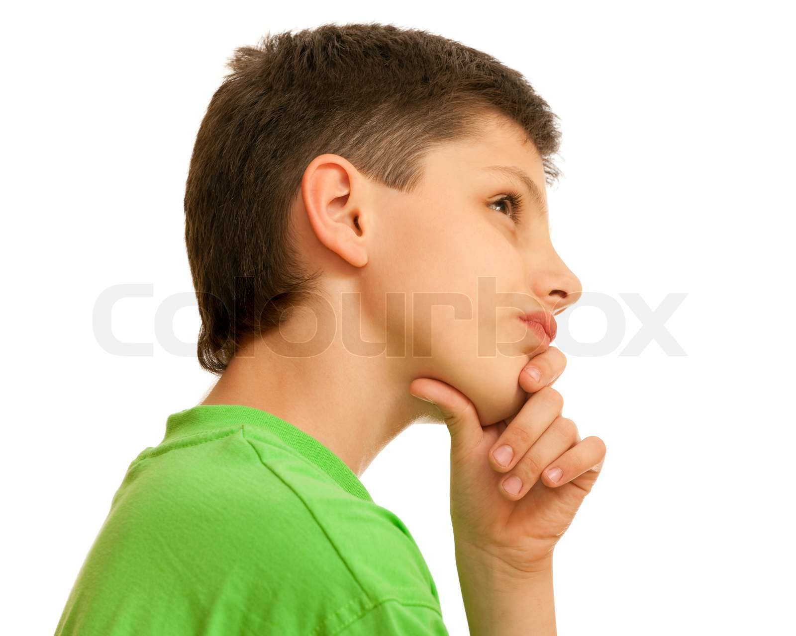 Doubtful boy in green | Stock image | Colourbox