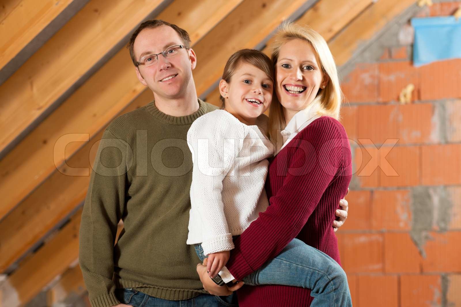 Young family on a construction site | Stock image | Colourbox
