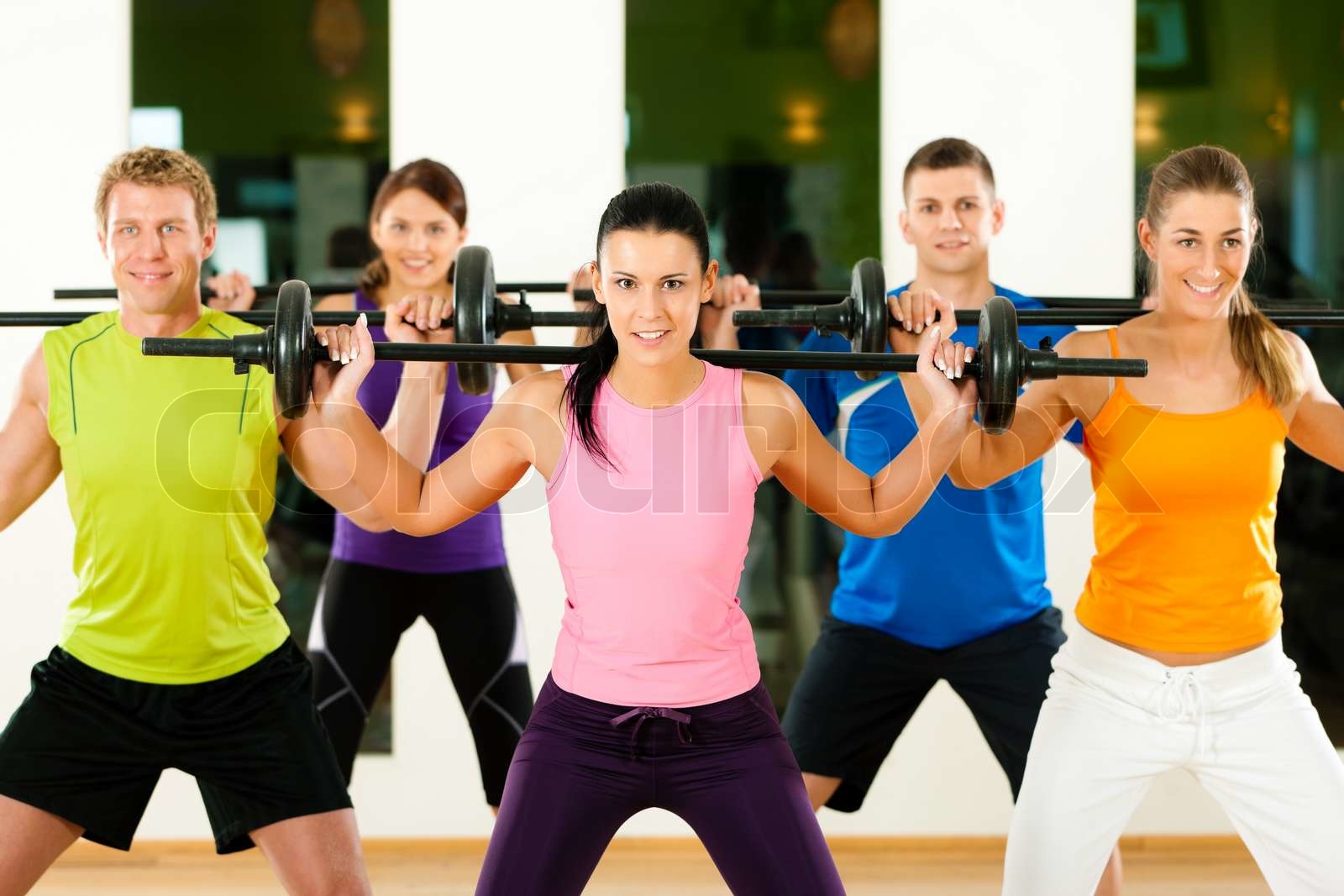 Fitness group with barbell in gym | Stock image | Colourbox