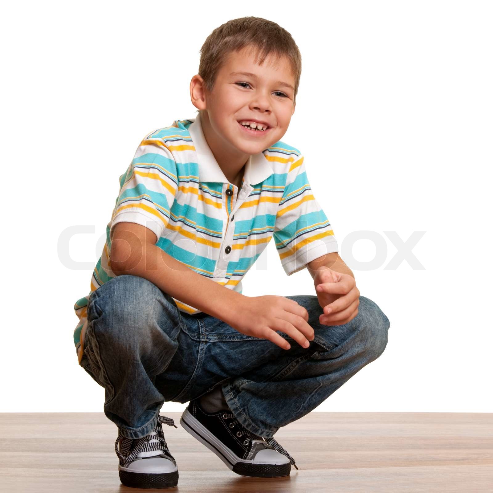 Squatting kid | Stock image | Colourbox