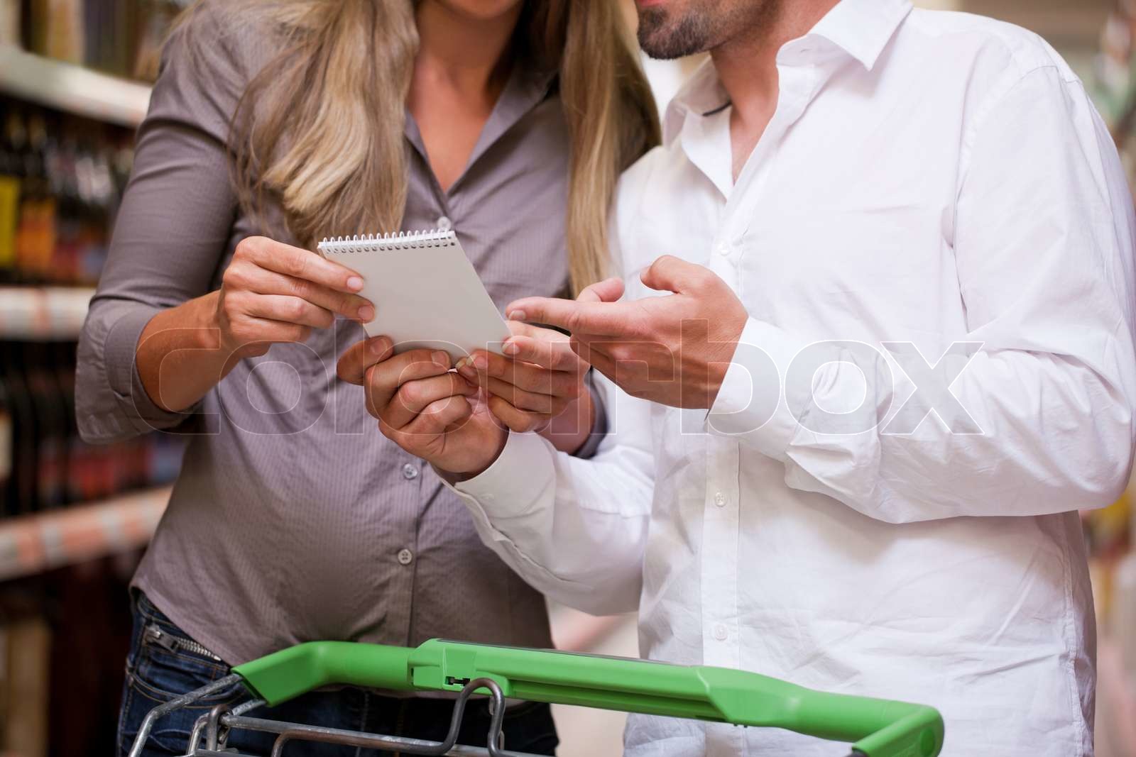Couple Selecting Products at Supermarket | Stock image | Colourbox