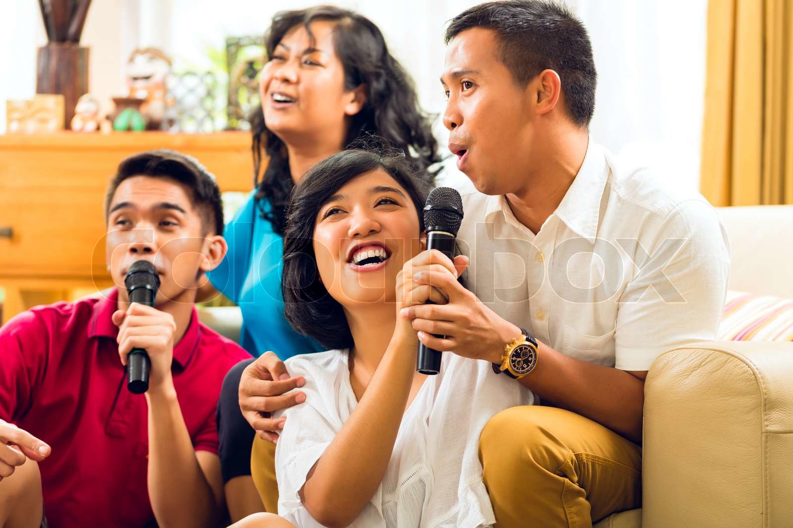 Asian people singing at karaoke party and having fun | Stock image ...