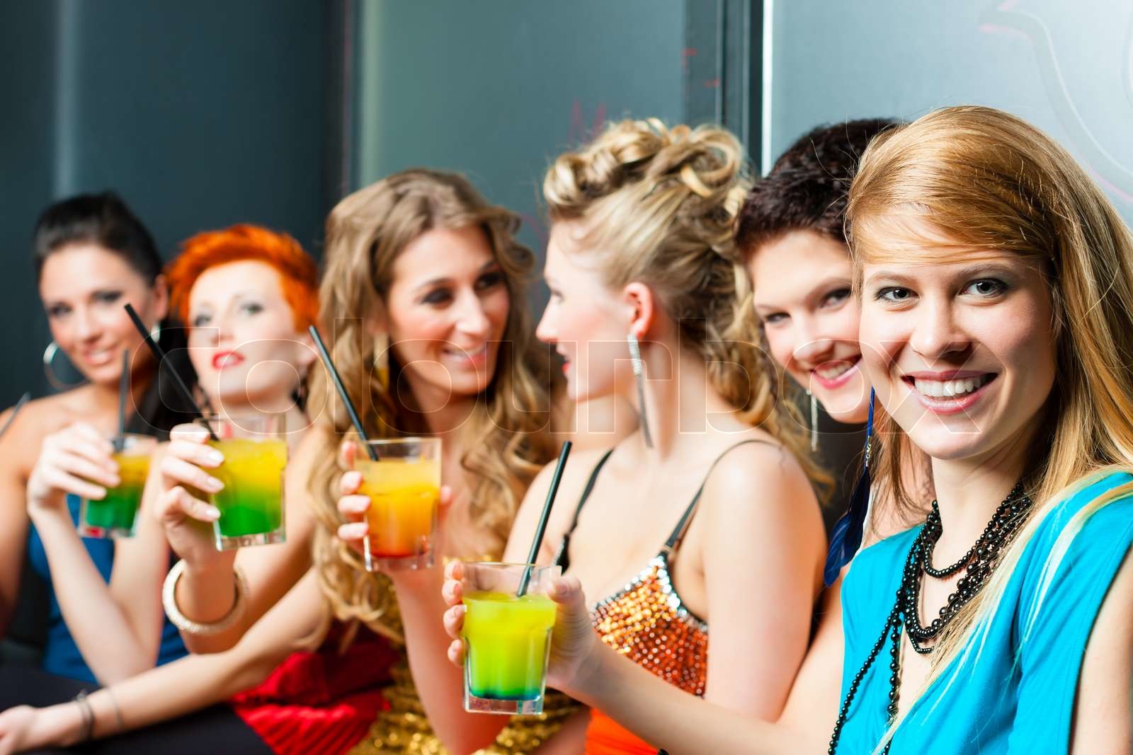Women in club or disco drinking cocktails | Stock image | Colourbox
