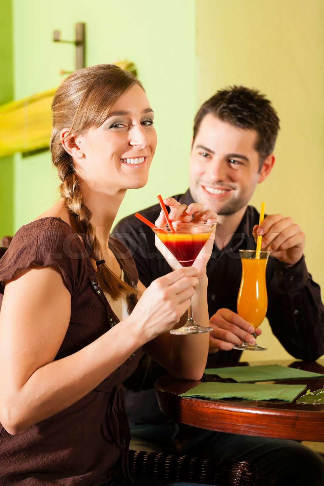 Young couple drinking cocktails in bar or restaurant | Stock image ...