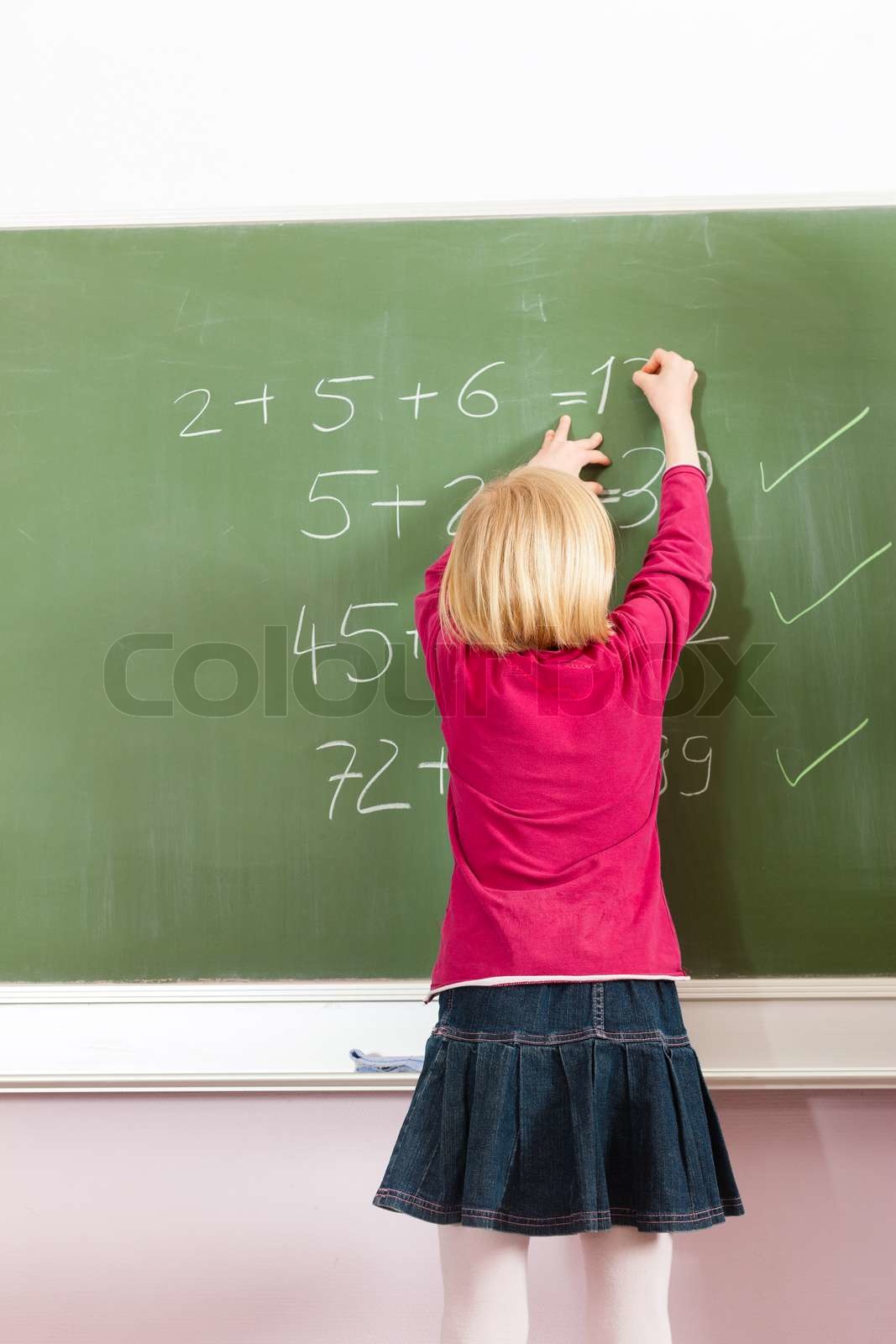 Education - Child at blackboard in school | Stock image | Colourbox